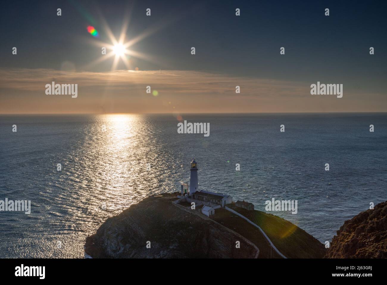 Sunset over South Stack lighthouse, Anglesey, North Wales Stock Photo ...