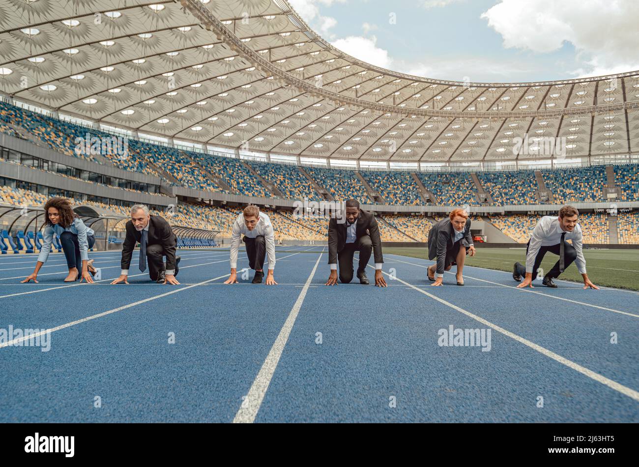 Front view photo of business team standing on race track Stock Photo ...