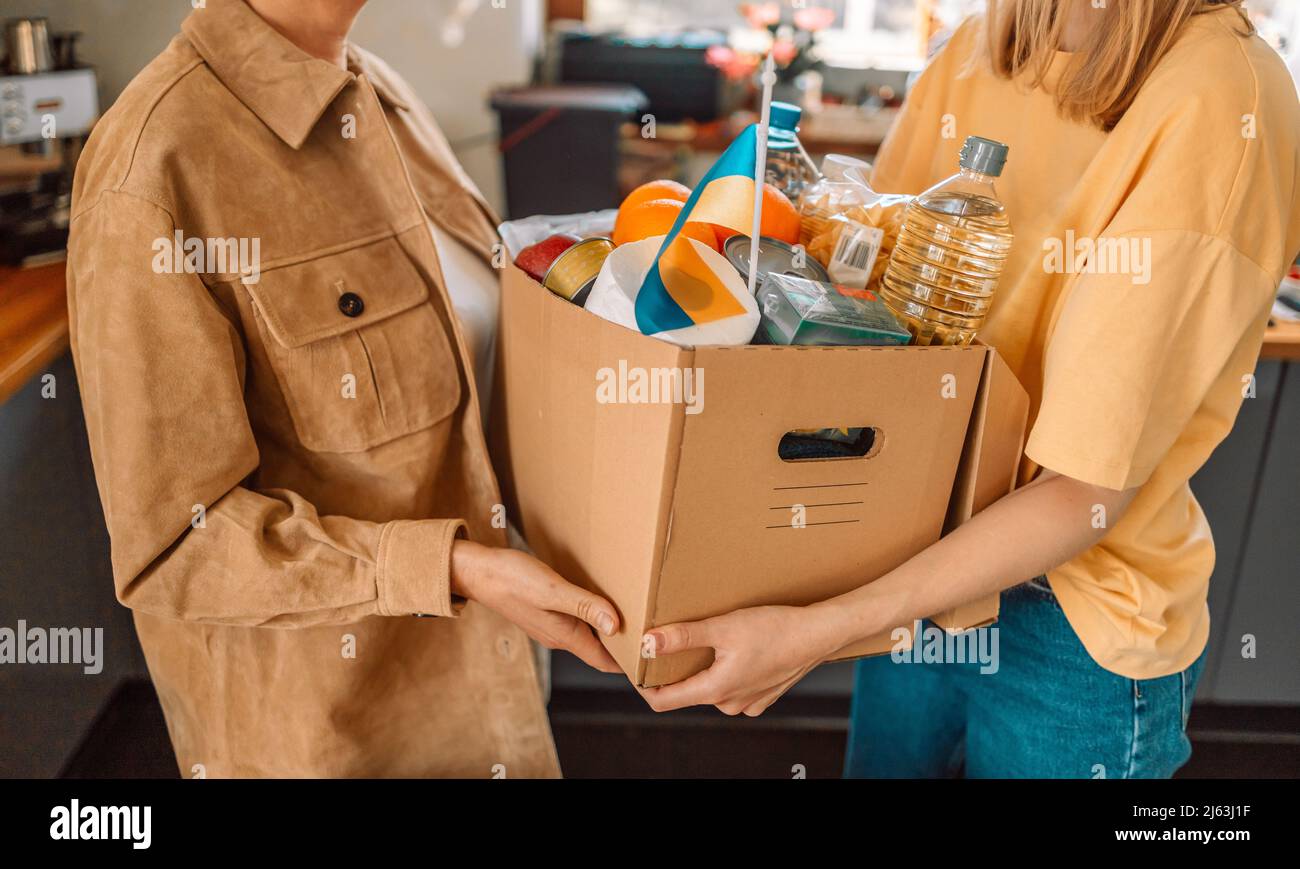 Donation boxes to homeless woman hi-res stock photography and images ...