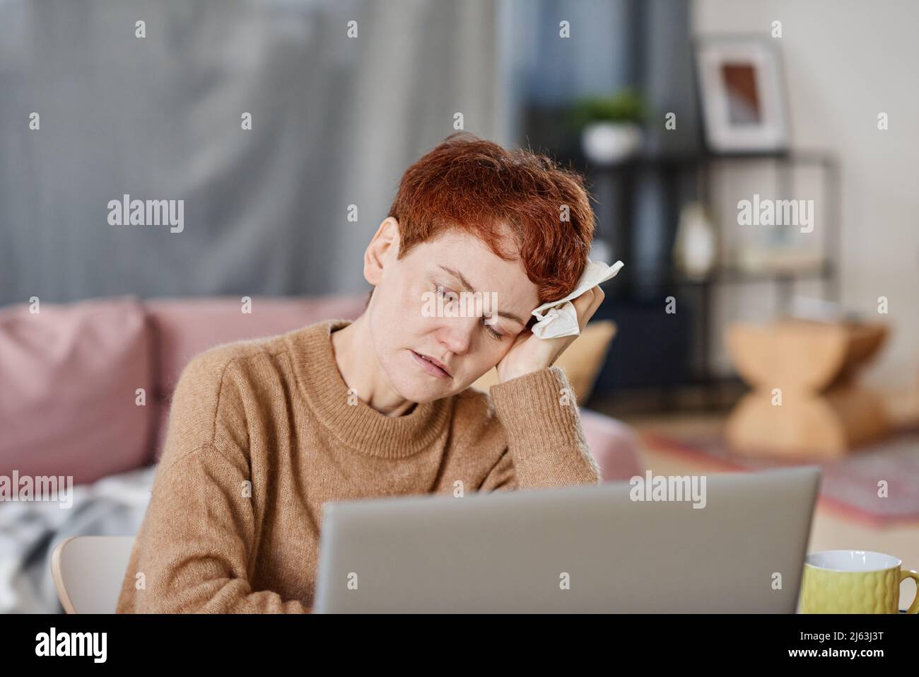 Horizontal medium close-up shot of mature Caucasian woman suffering ...