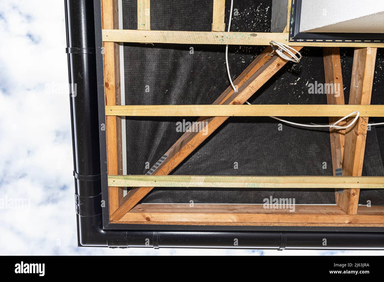 Scaffolding with three rows of wooden battens for attaching the PVC ...