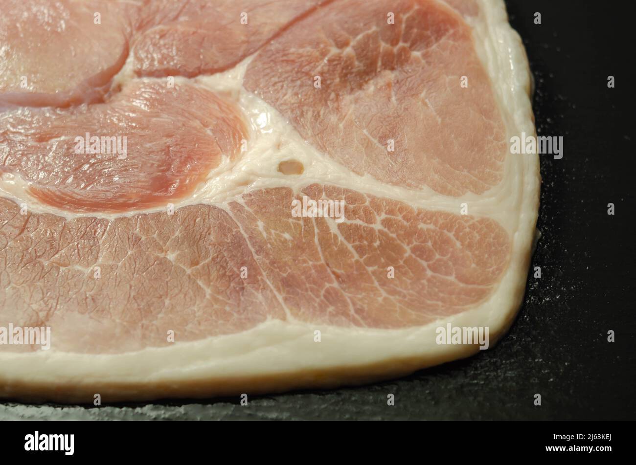 Smoked gammon steak formed from selected cuts of cured pork leg ...