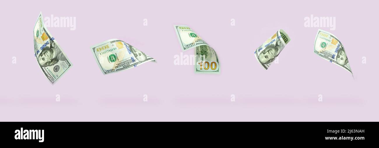Flying 100 American dollars banknotes, on pink background. Hundred ...