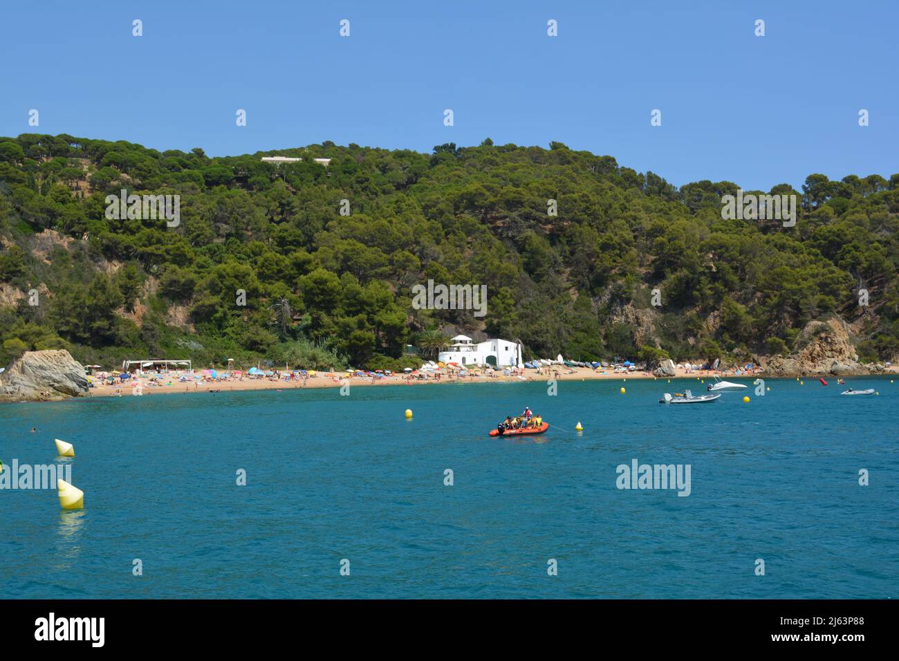 The beach of Cala Canyelles in summer on a beautiful day, mediterranean ...