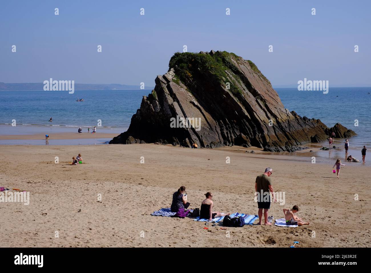 People enjoying early Spring sunny weather on Tenby North Beach, Tenby ...