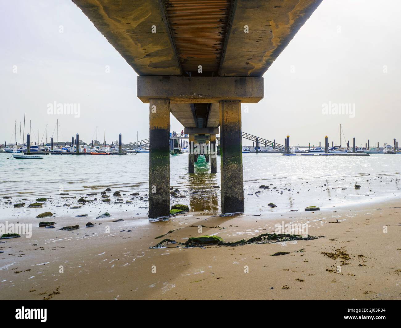 Large concrete columns support a bridge over the Huelva river Stock ...