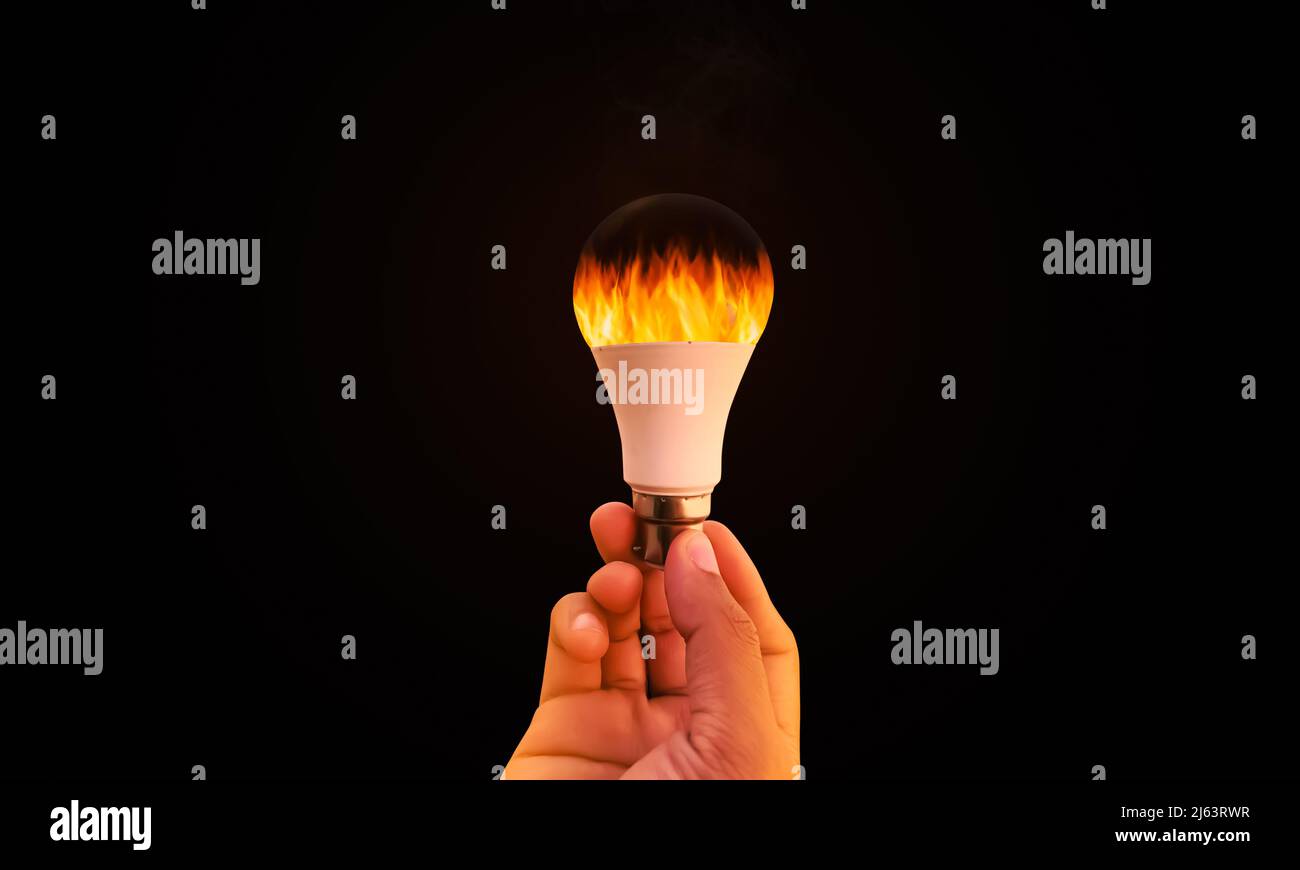 Burning Ideas Concept Background with Fire inside Bulb, Man Holding ...