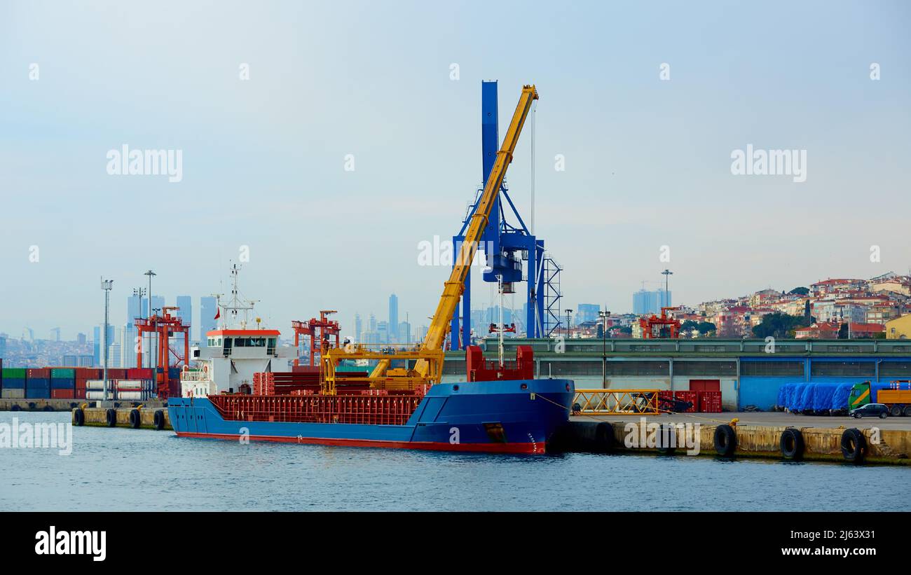 Logistics and transportation of Cargo ship with working crane bridge in ...