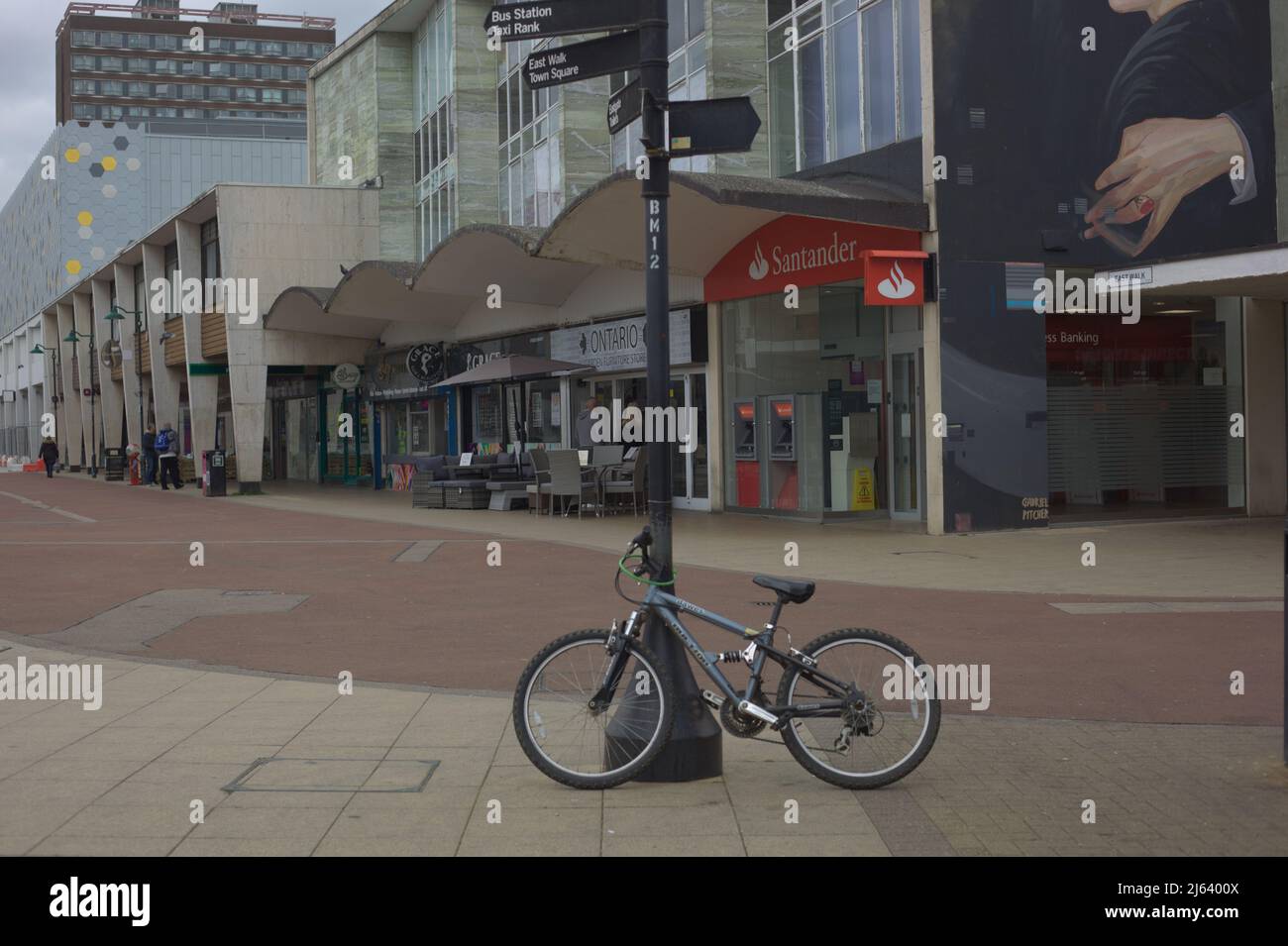 Street view of retail shops and Santander Bank branch at Basildon Town ...