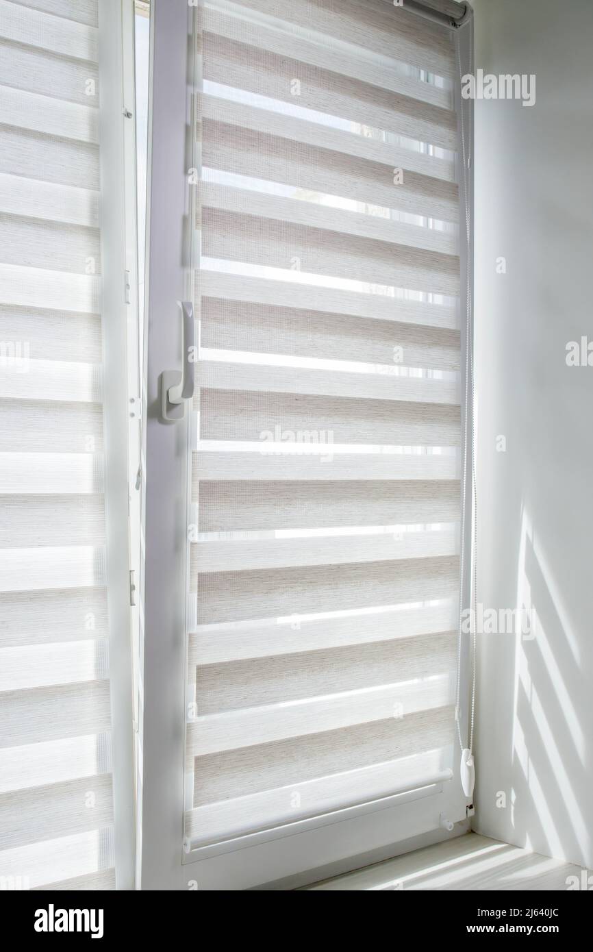 Window roller duo system day and night. Close up on roll curtains ...