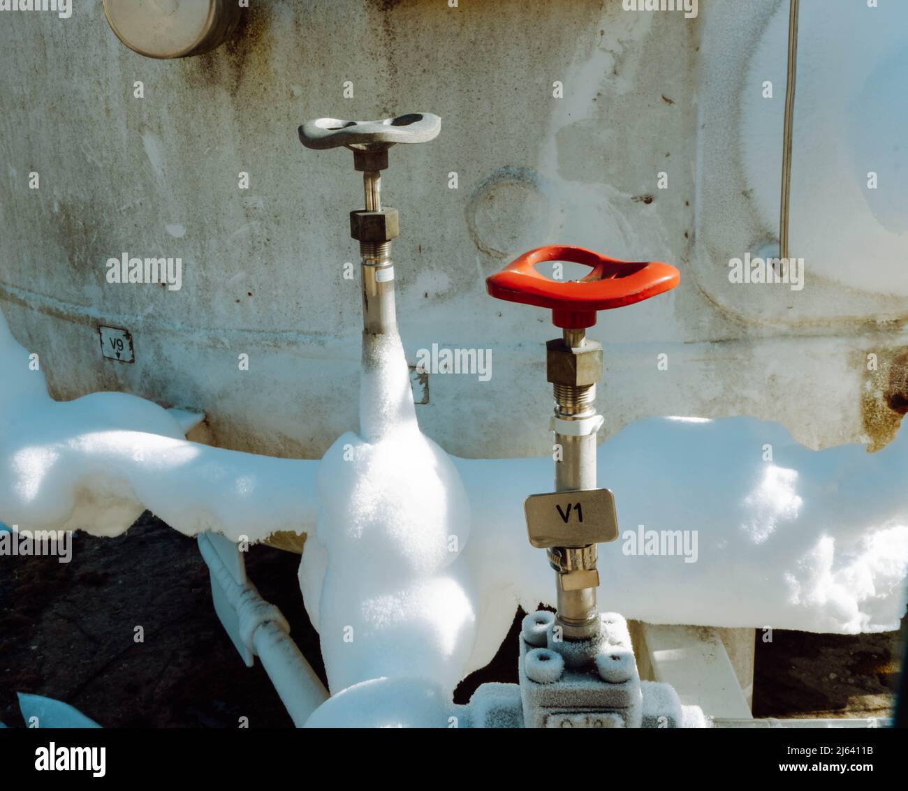 Frozen liquid nitrogen storage tank transfer valve. Close up shot, no ...