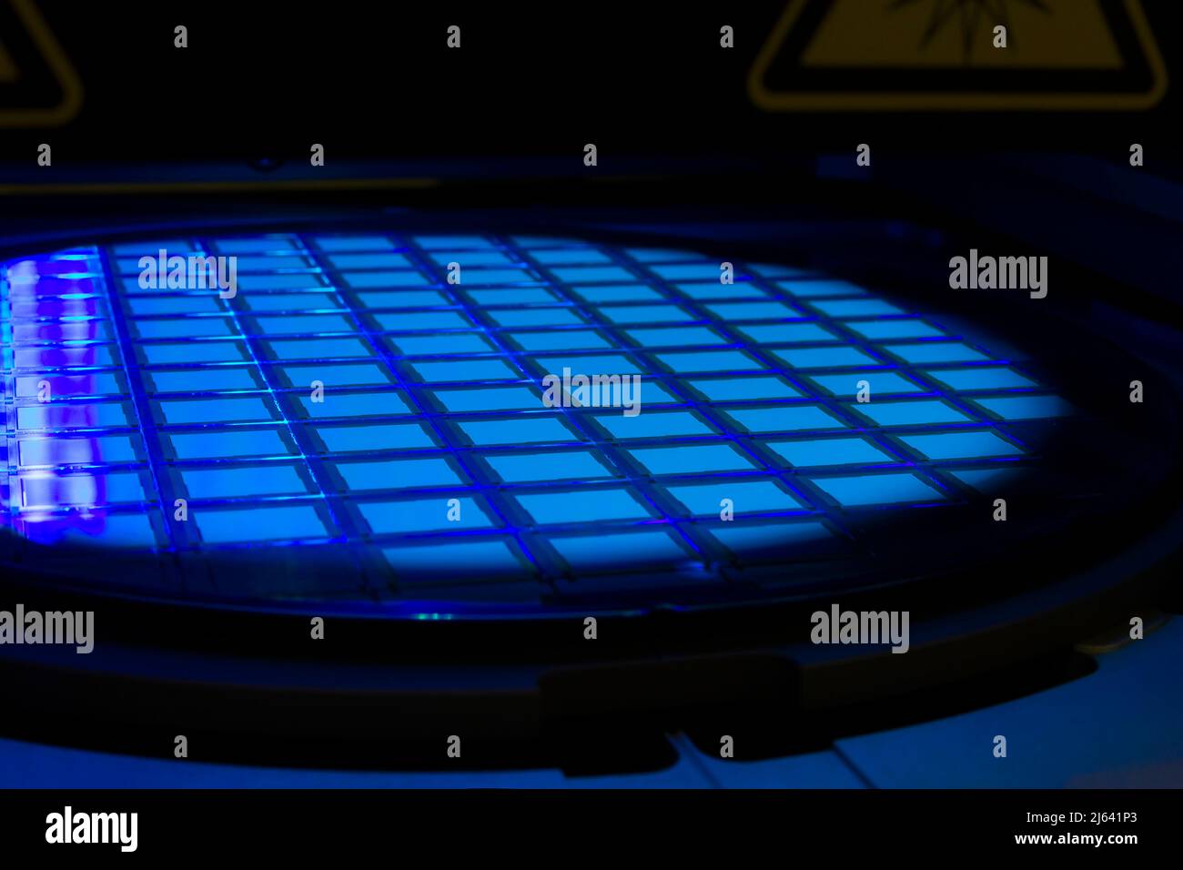 Silicon wafer with chips lightinhg in neon light. Semiconductor Stock ...