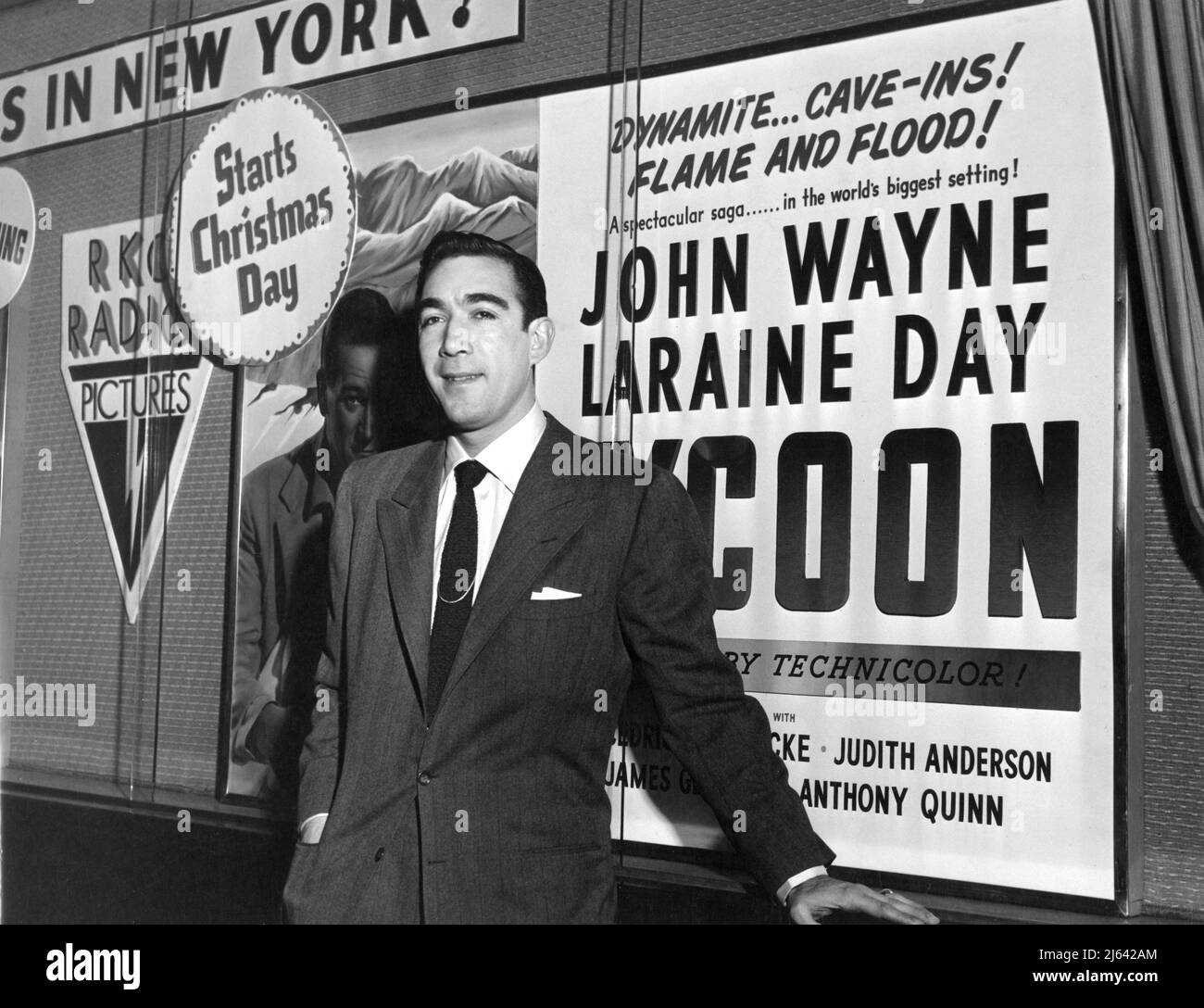 ANTHONY QUINN in front of Lobby Display at the RKO Palace movie theatre ...