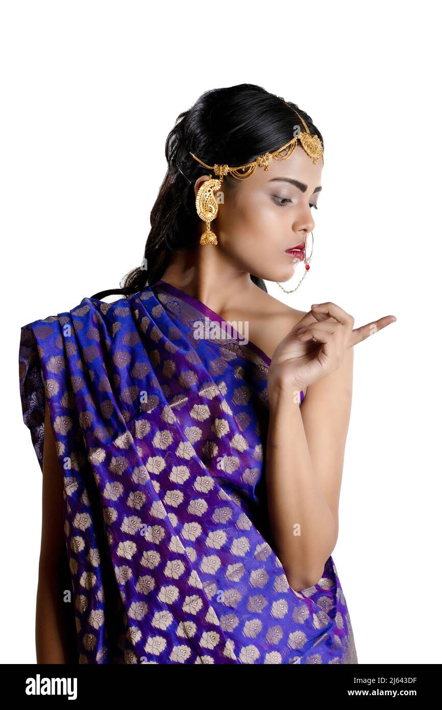 An Indian Girl Wearing A Traditional Indian Blue Saree And Simple
