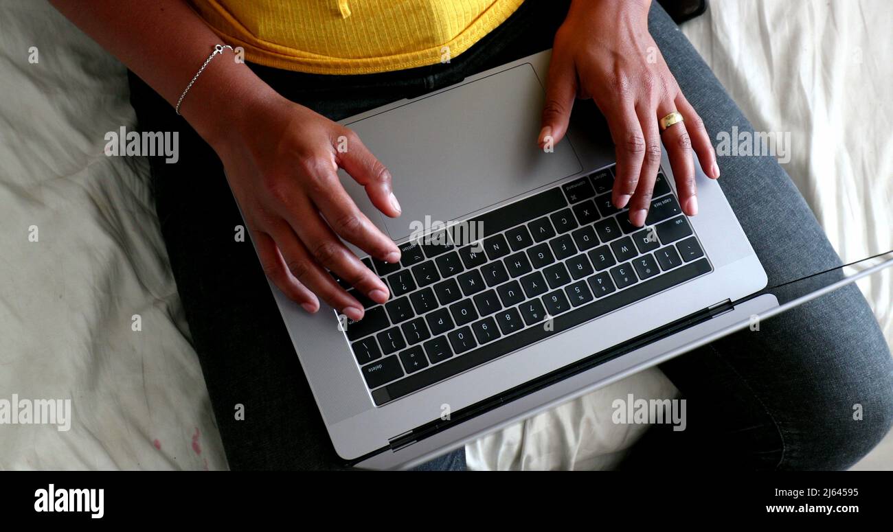 Black woman hands typing on laptop computer Stock Photo - Alamy