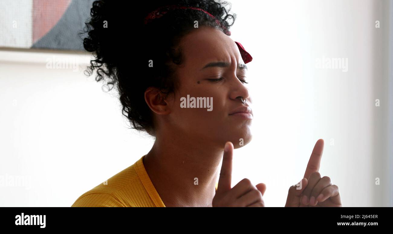 Candid young woman looks to camera smiling Stock Photo - Alamy