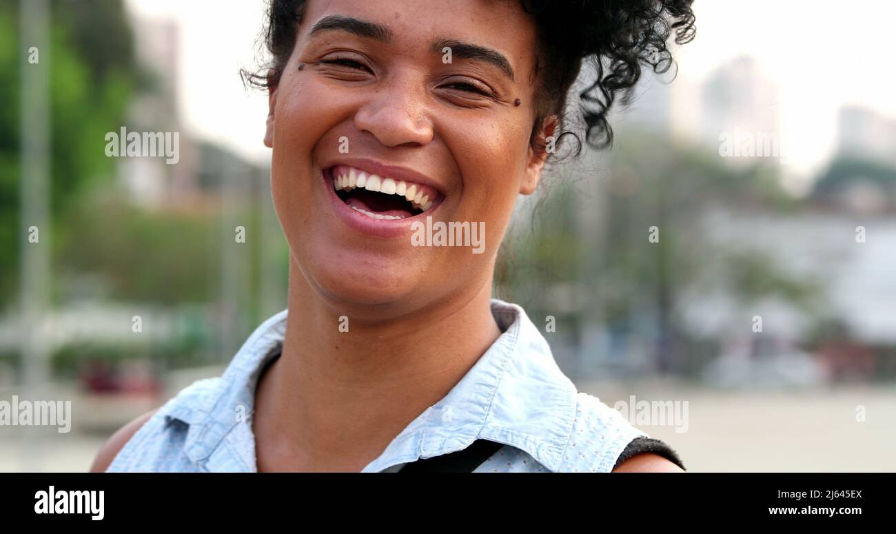 Happy joyful young woman spontaneous smile and laugh Stock Photo - Alamy
