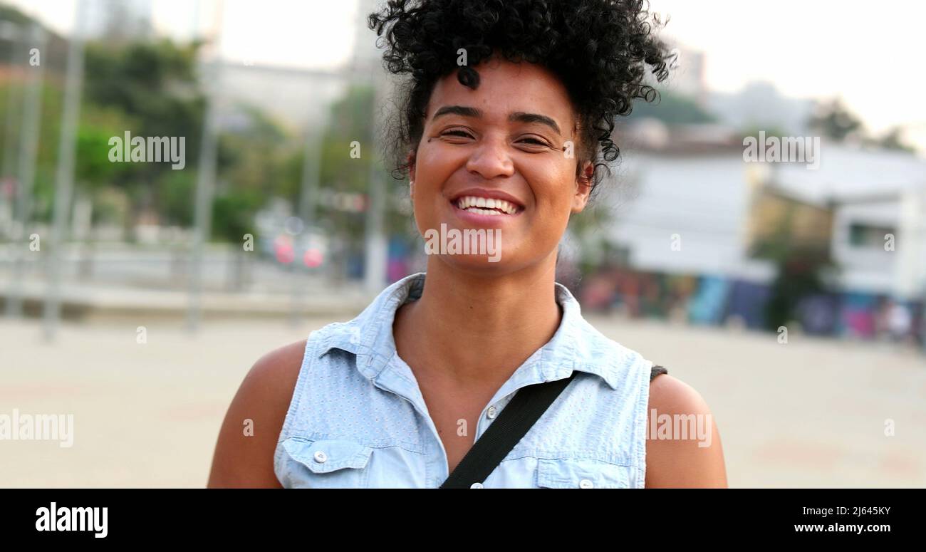Happy young black woman spontaneous smile and laugh. Person with ...