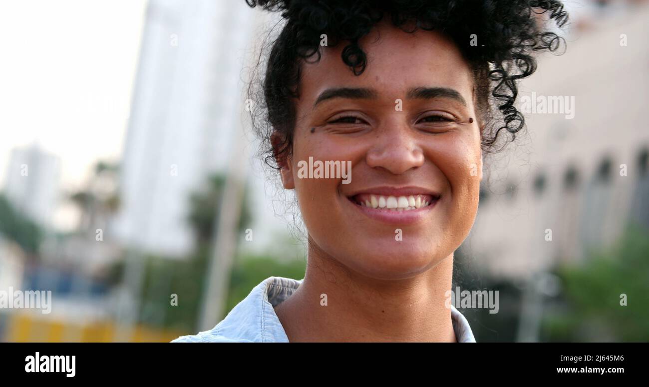 Happy young black woman spontaneous smile and laugh. Person with ...