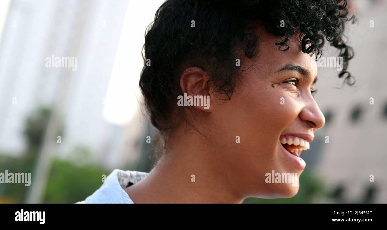 Happy young black woman spontaneous smile and laugh. Person with ...