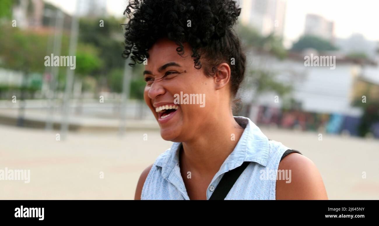 Happy young black woman spontaneous smile and laugh. Person with ...