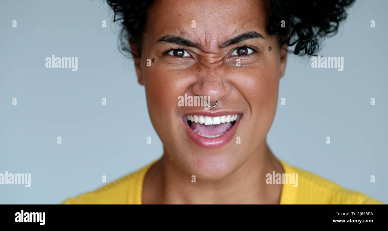 Millennial black woman shouting at camera Stock Photo - Alamy