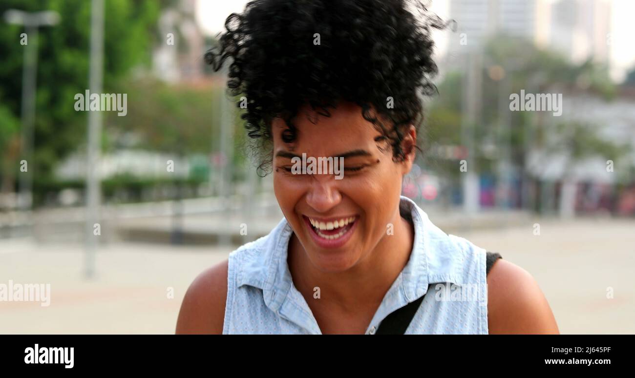 Happy young black woman spontaneous smile and laugh. Person with ...
