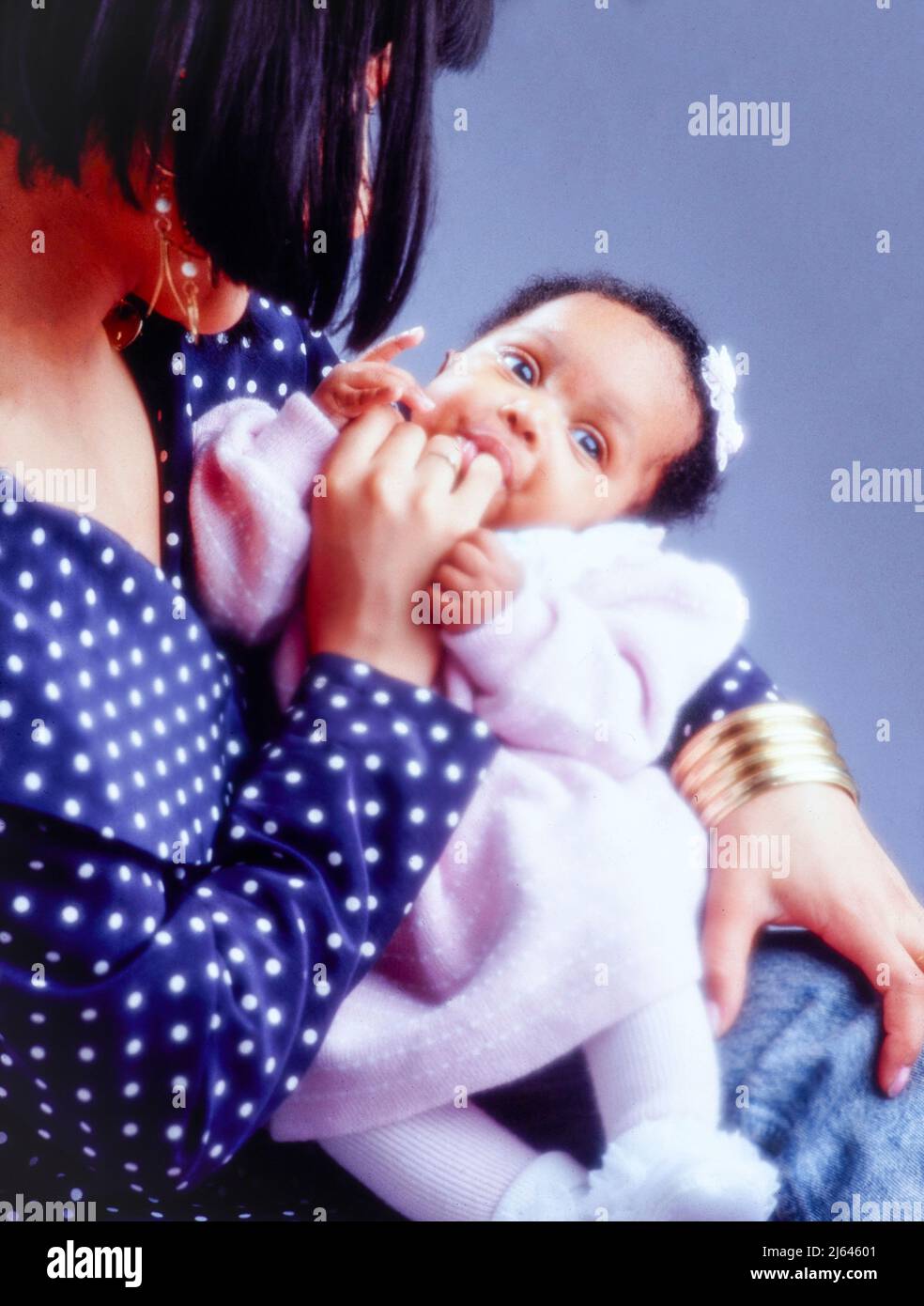 Charming close-portrait of mother soothing baby with her finger Stock ...