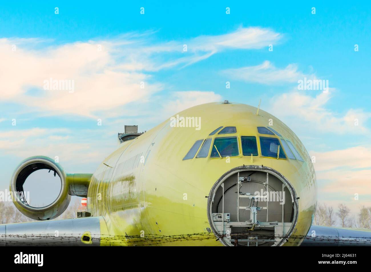 Old destroyed aircraft without a nose fairing and engines on the tail ...
