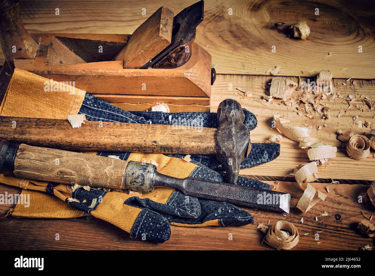Carpenters tool kit, hammer, chisel and plane with gloves wooden ...