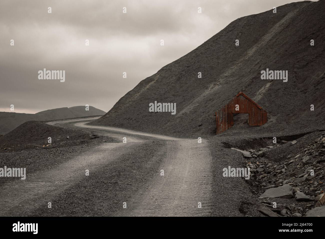Derelict Corrugated Iron House, half buried in a large shale pile near ...