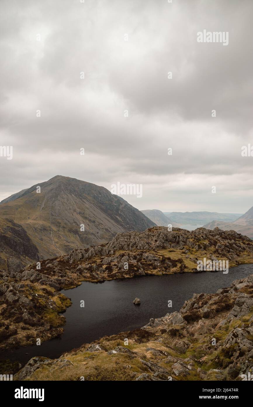 Mirror-like Highland lake in a rocky landscape, along the Haystacks ...