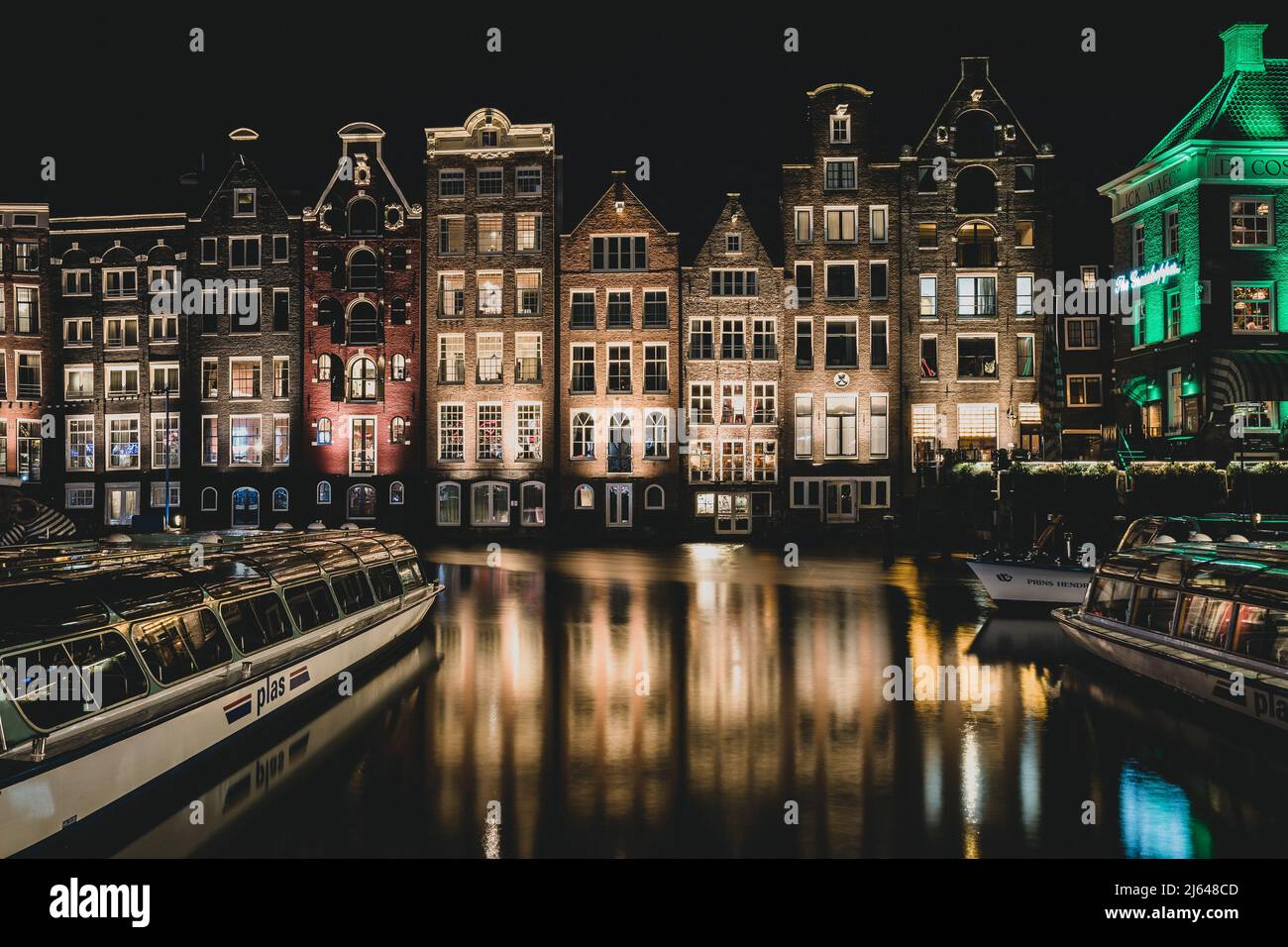 Canal Houses Illuminated at Night in Amsterdam, Netherlands Stock Photo ...