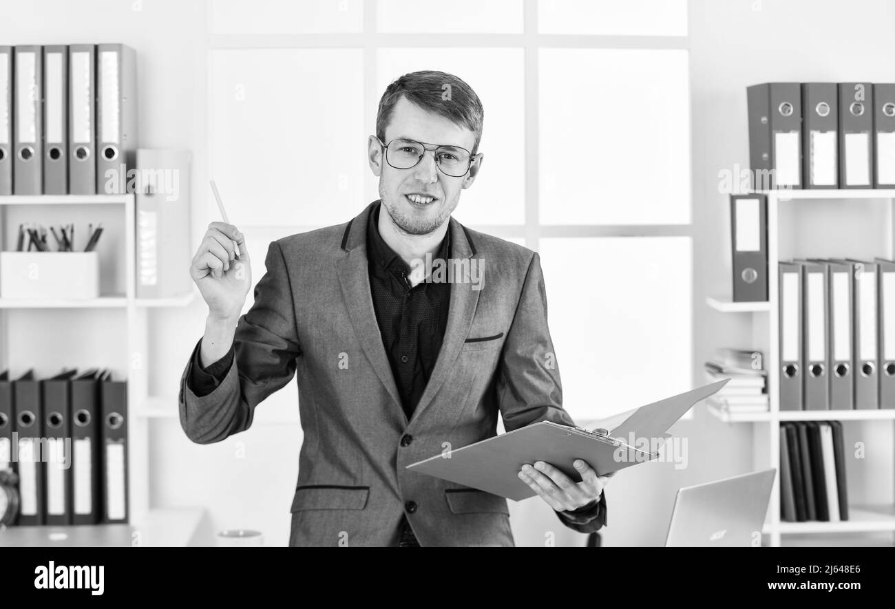 Man in jacket folder successful manager work with documents, inspecting ...