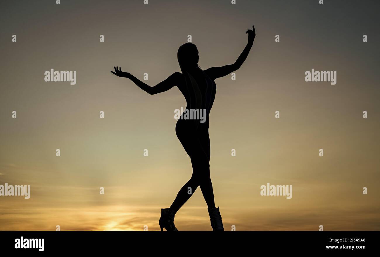 Rise of inspiration. Woman silhouette on evening sky. Inspirational ...