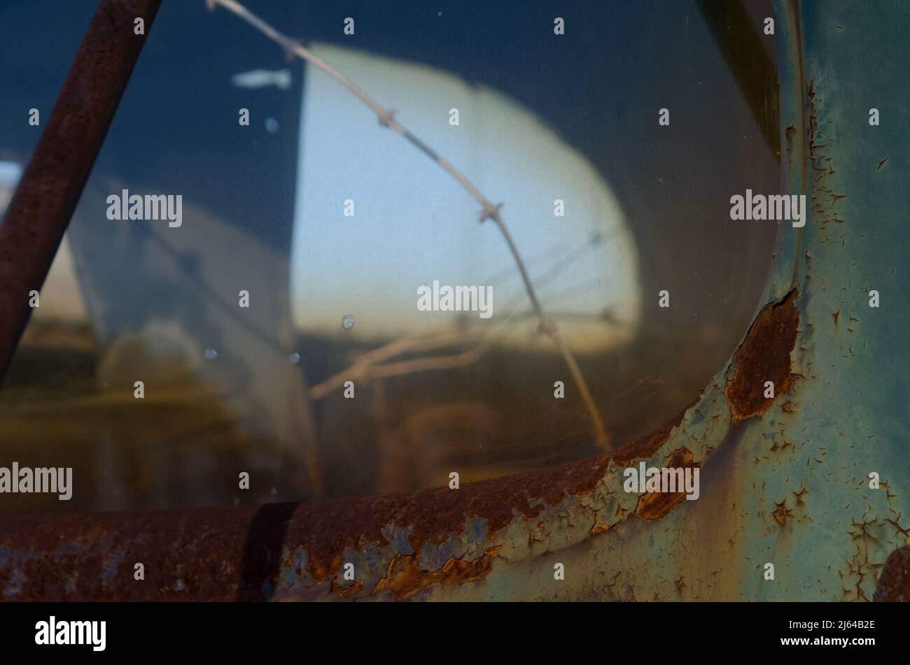 Abstract of sunset through windshield through old car window Stock ...