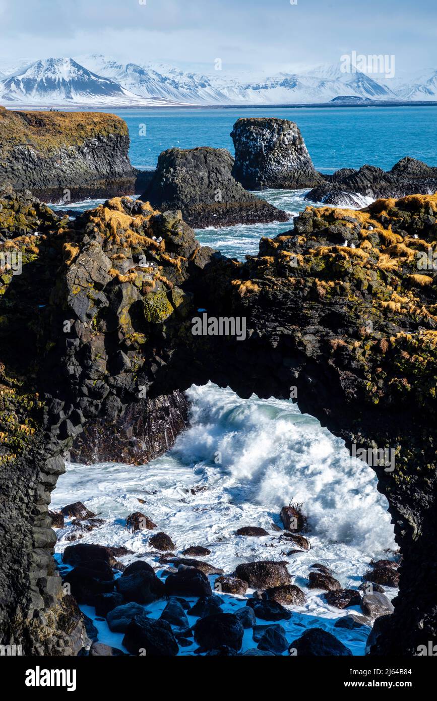 Photograph of the volcanic rock bridge at the Gatklettur Cliff walk ...