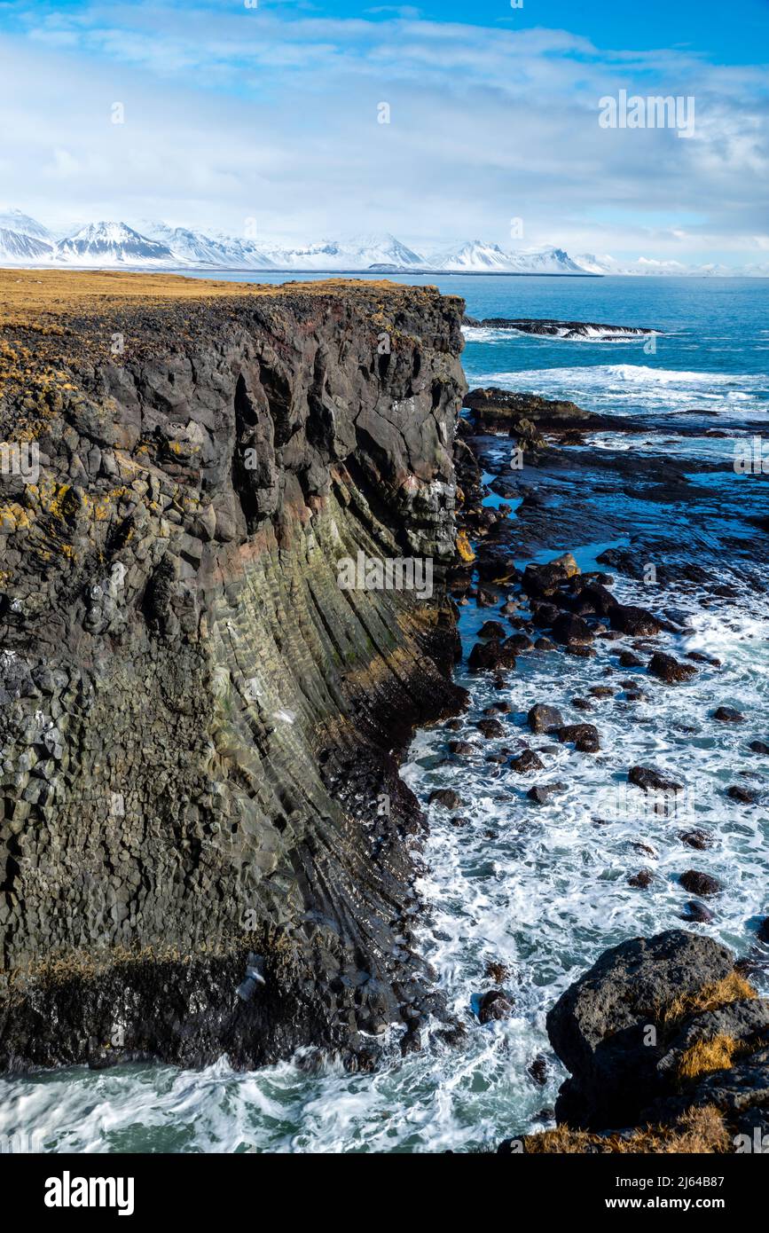 Photograph of the volcanic rock bridge at the Gatklettur Cliff walk ...