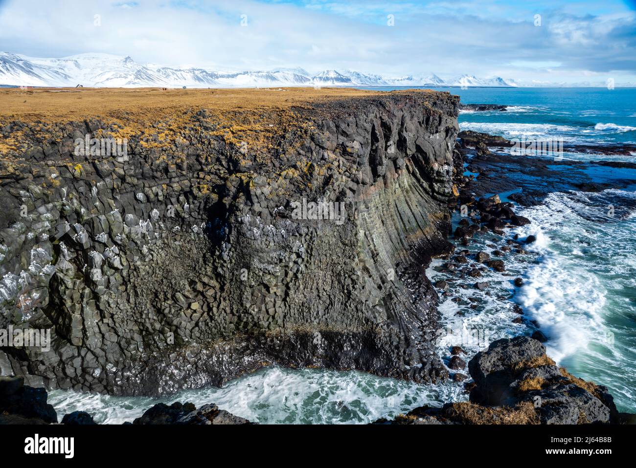 Photograph of the volcanic rock bridge at the Gatklettur Cliff walk ...