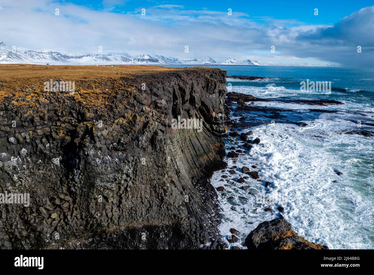 Photograph of the volcanic rock bridge at the Gatklettur Cliff walk ...