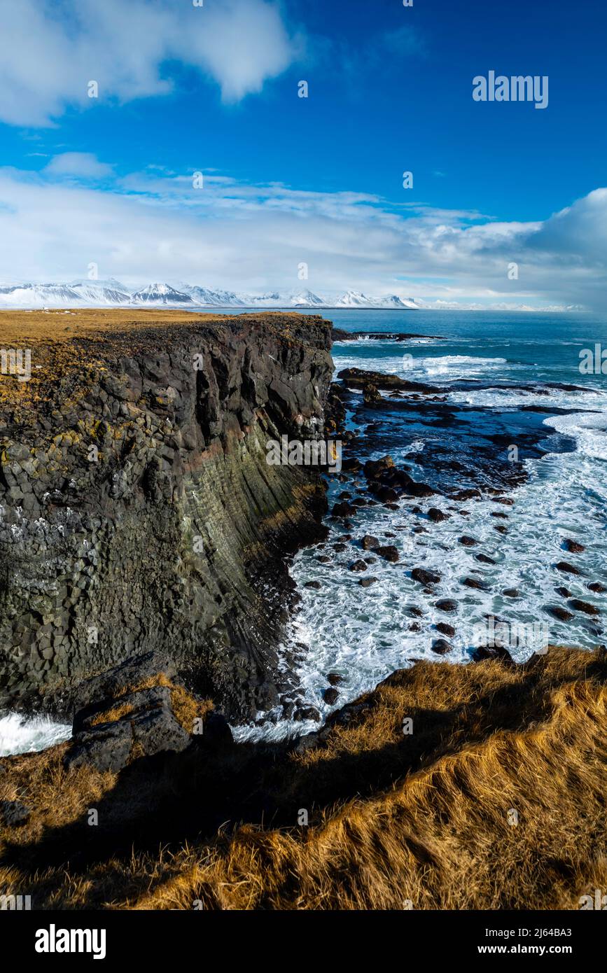 Photograph of the volcanic rock bridge at the Gatklettur Cliff walk ...