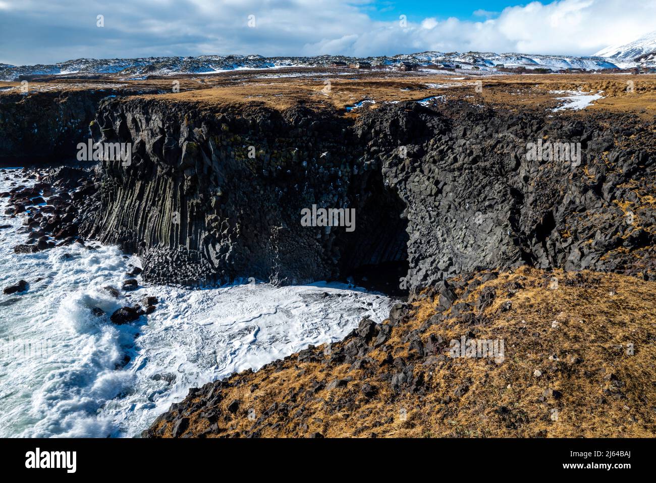 Photograph of the volcanic rock bridge at the Gatklettur Cliff walk ...