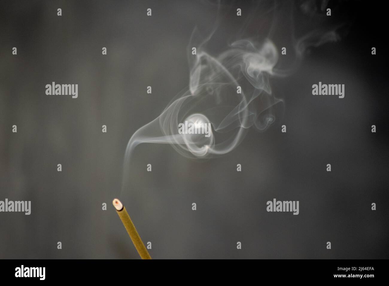 smoke from a burning incense Stock Photo - Alamy