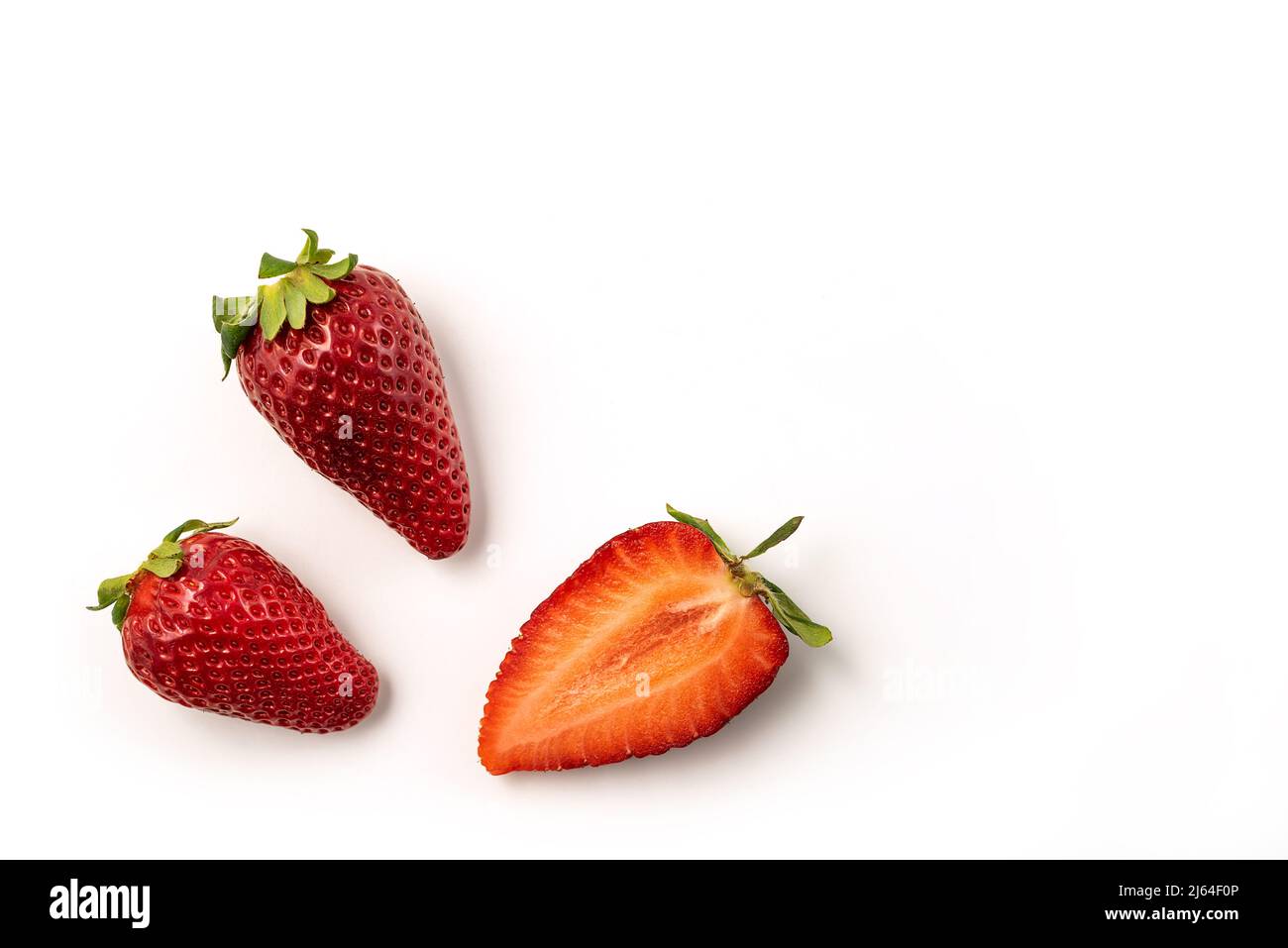 Red, fresh, ripe early strawberries isolated on a white background with ...