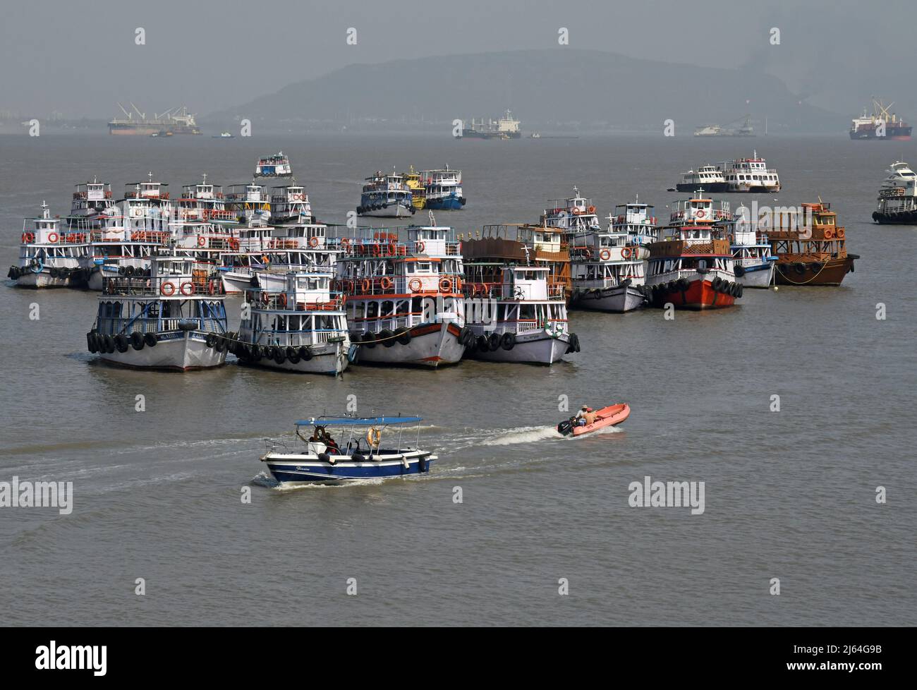 Mumbai, Maharashtra, India. 27th Apr, 2022. Ferry boats anchored at the ...