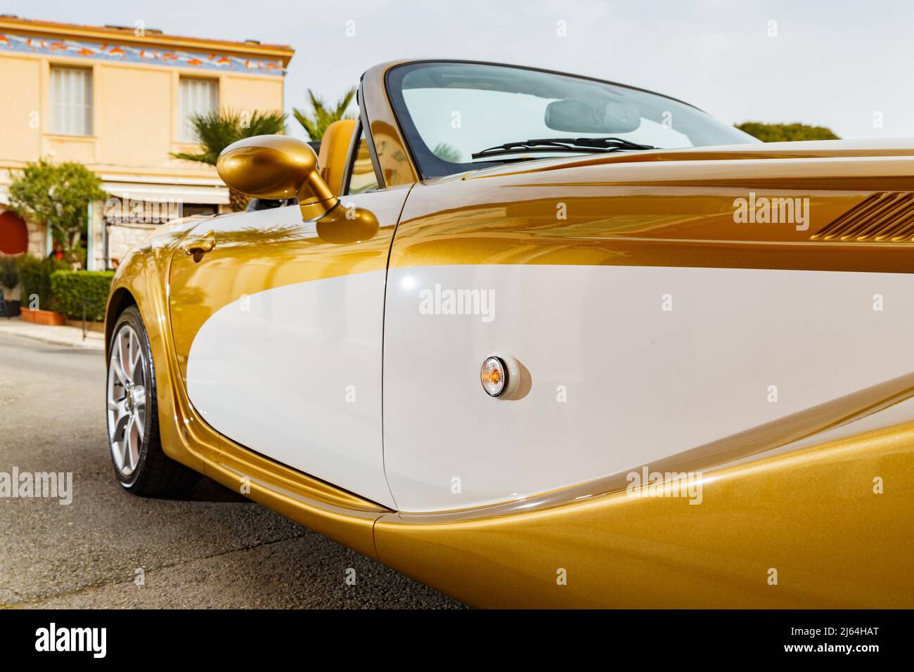 Close up view of exclusive vintage car is standing on narrow small ...