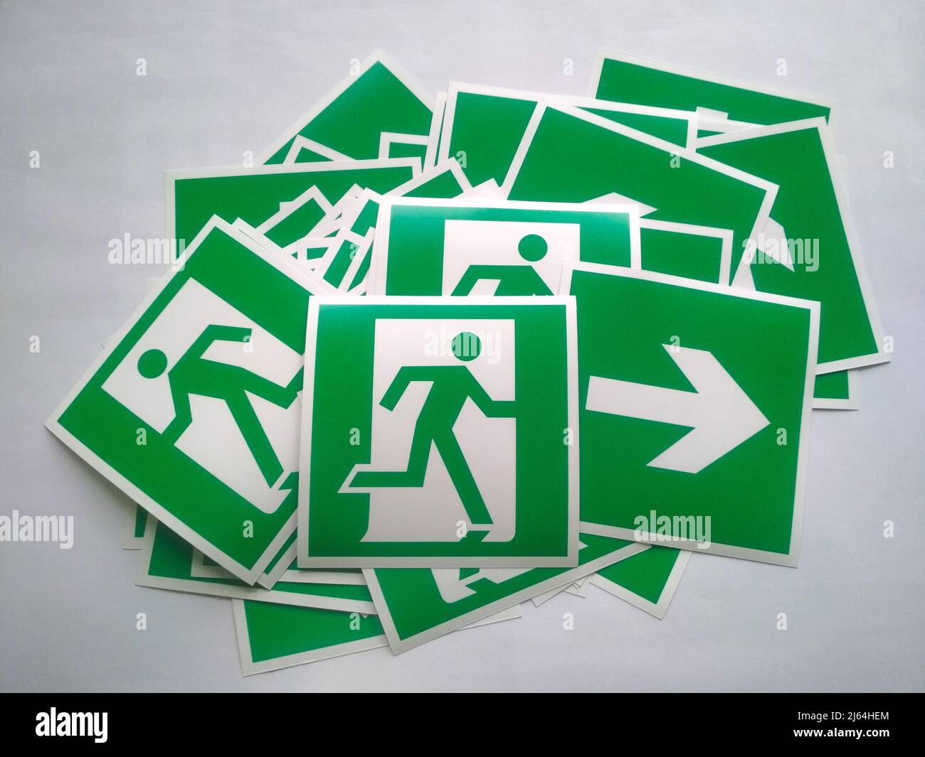 Sign fire escape. White symbol on green background. Emergency arrow ...