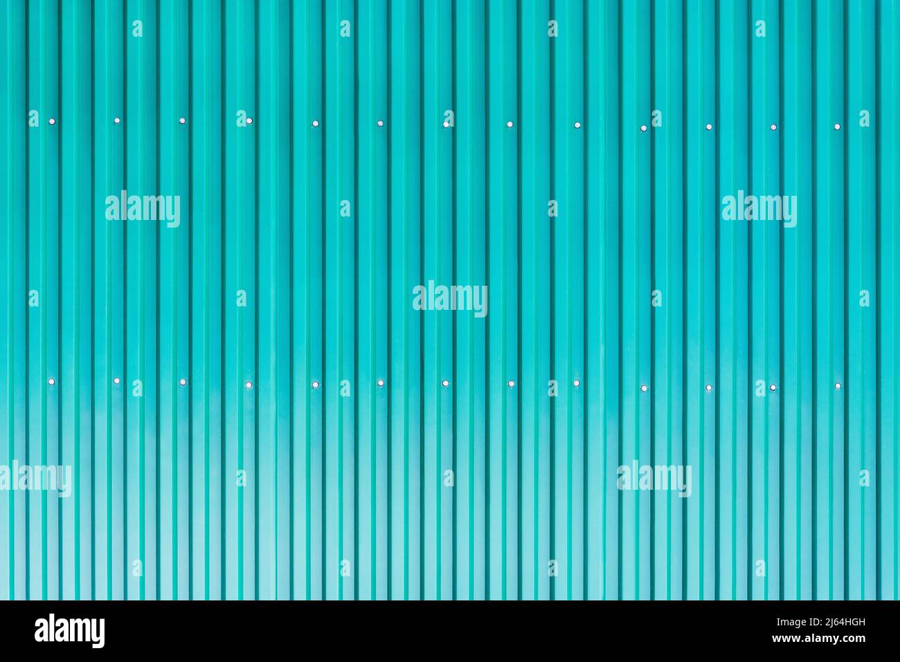 Green vertical metal fence background Stock Photo - Alamy