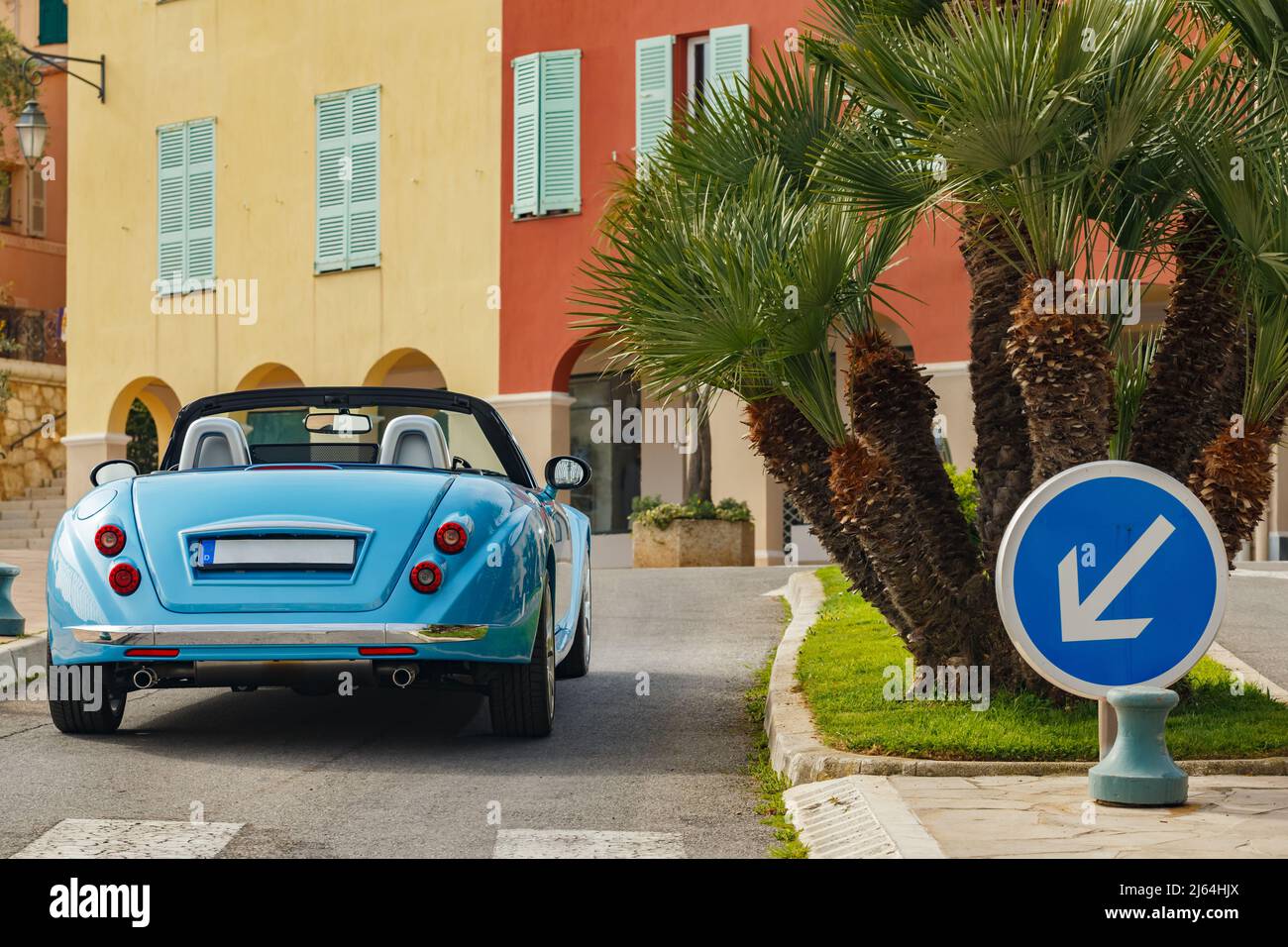 Exclusive vintage car is standing on narrow small streets, replica on ...