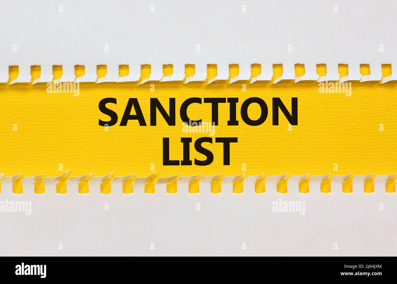 Sanction list symbol. Yellow and white paper with concept words Sanction list on beautiful white ...